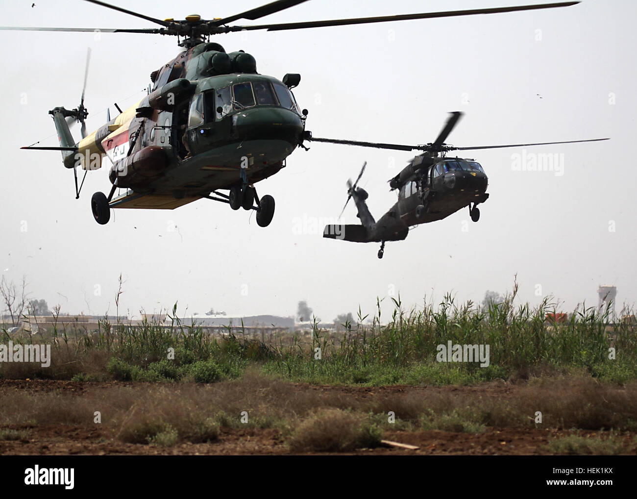 An MI-17 HIP helicopter from the Iraqi Air Force and a UH-60 Black Hawk ...