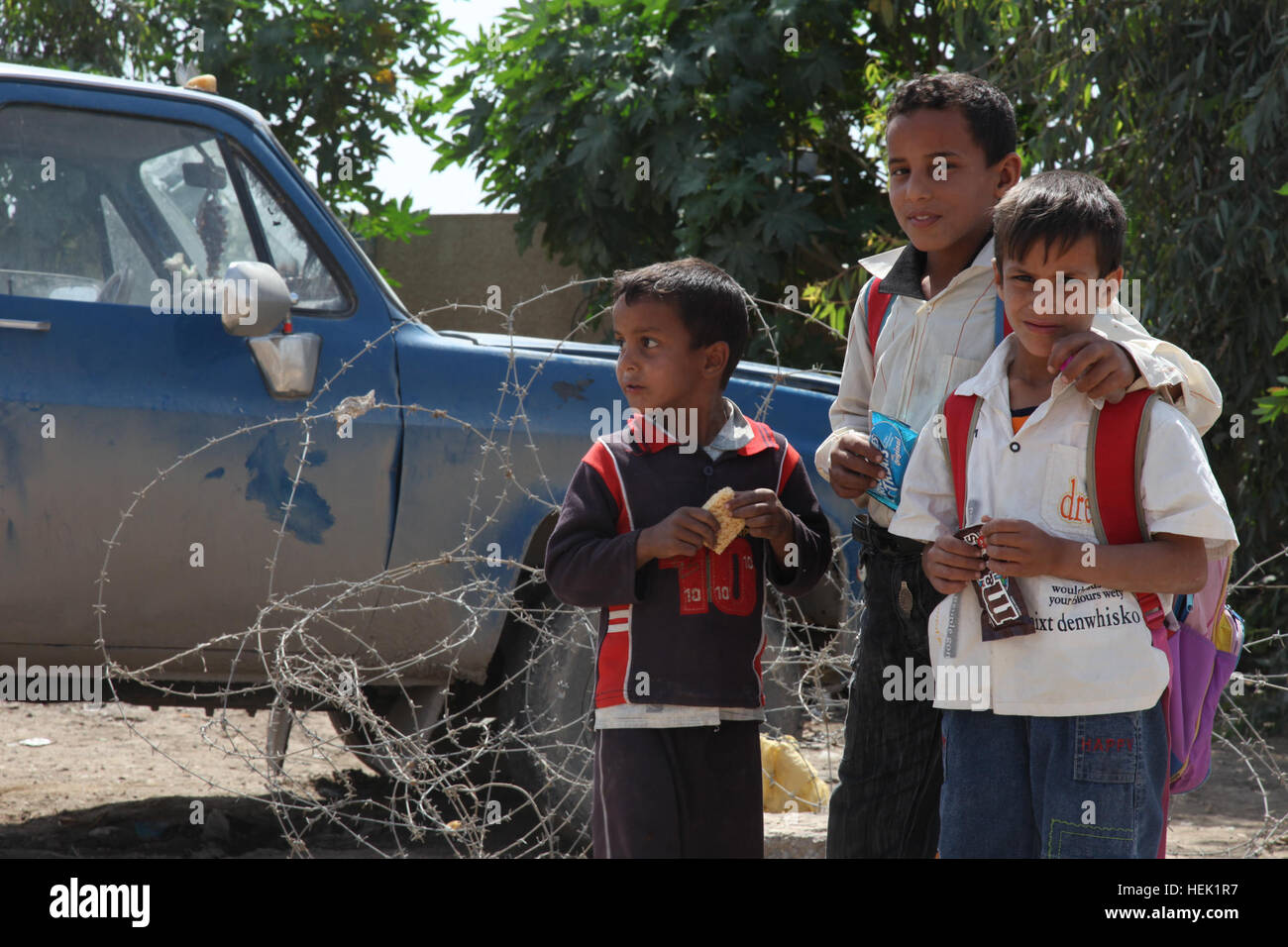 Young Iraqi boys enjoy treats they were given by U.S. Soldiers of Bravo ...