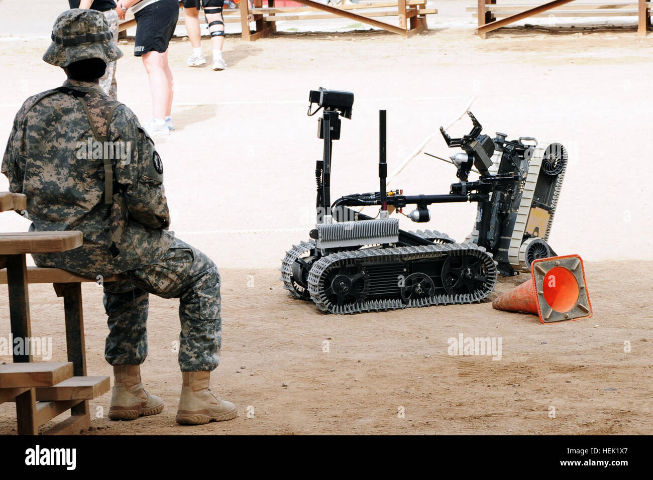 An onlooker enjoys a round of "robot wars," a friendly competition ...