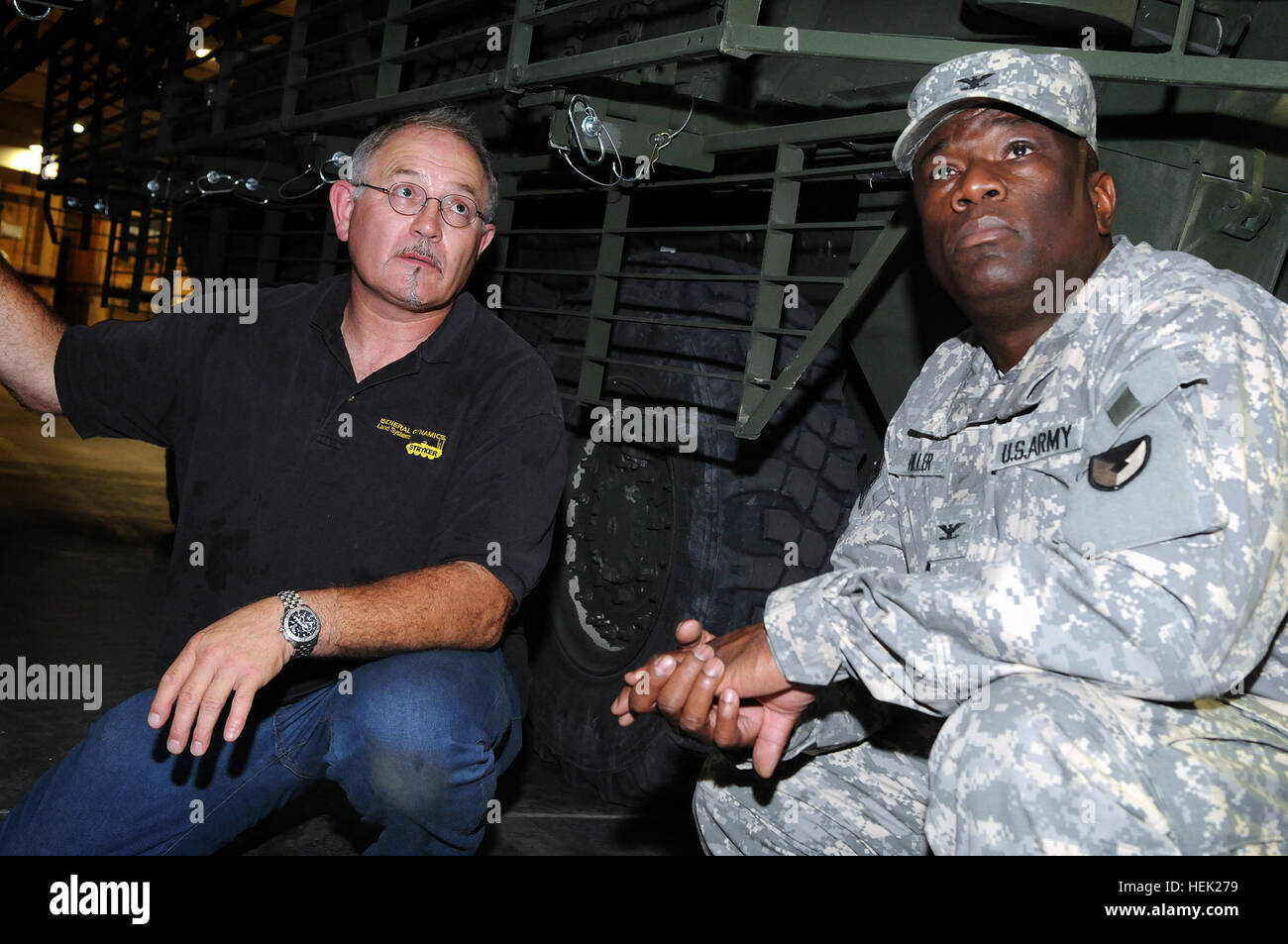 Dar Barker, a General Dynamics Land Systems retrofit chief, talks with ...