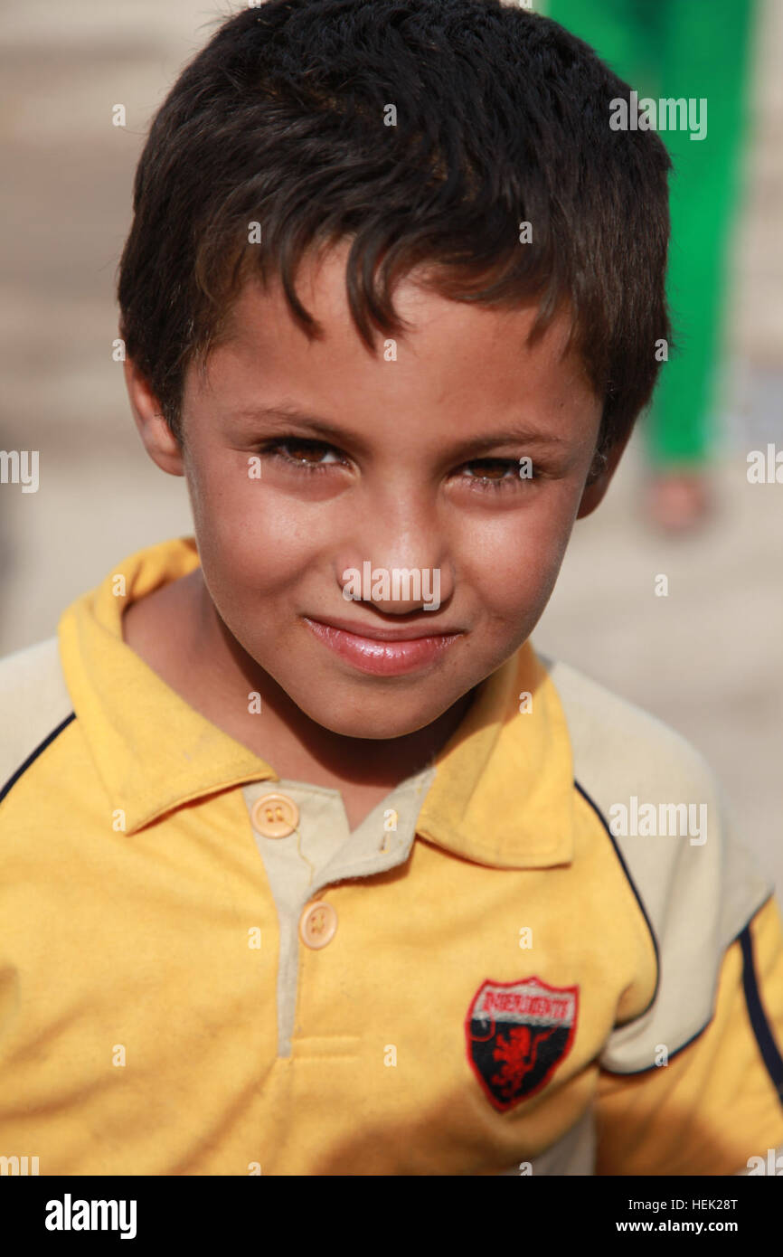 An young Iraqi boy watches as U.S. Soldiers from the 17th Fires Brigade ...