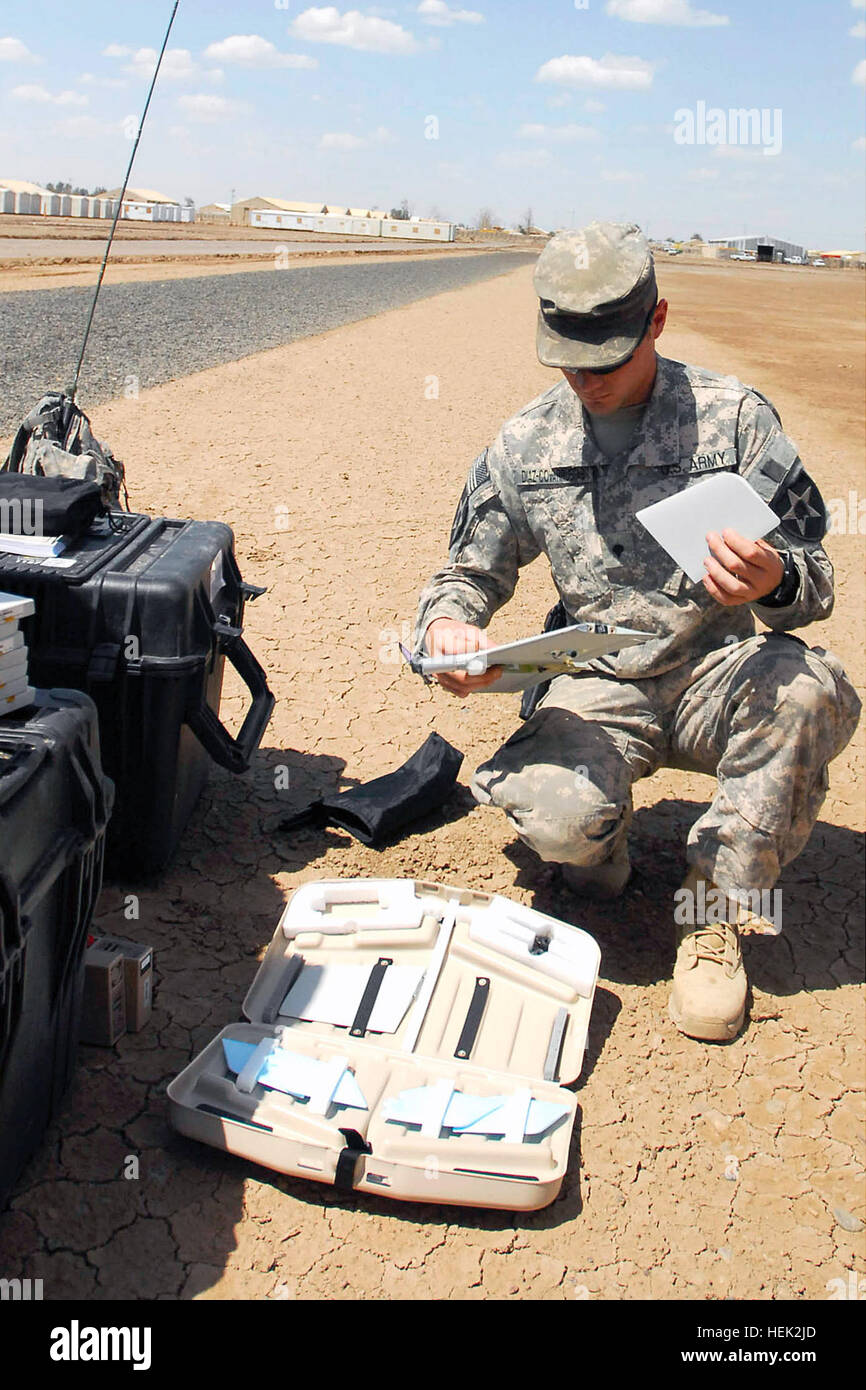 A U.S. Army Soldier assembles a Wasp III unmanned micro aerial vehicle ...