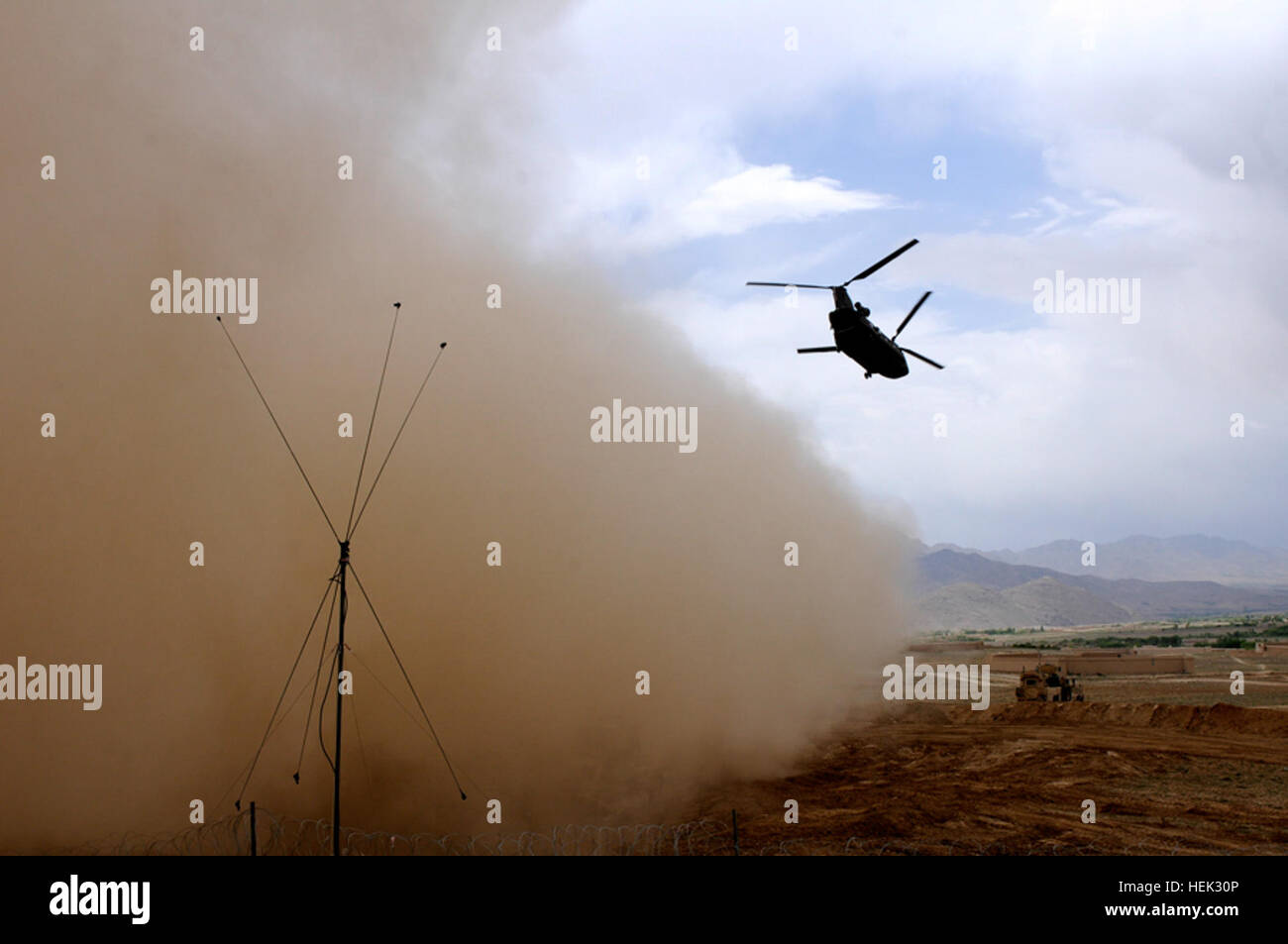 A CH-47 Chinook flies away from Combat Outpost Jaghato in the Jaghato ...