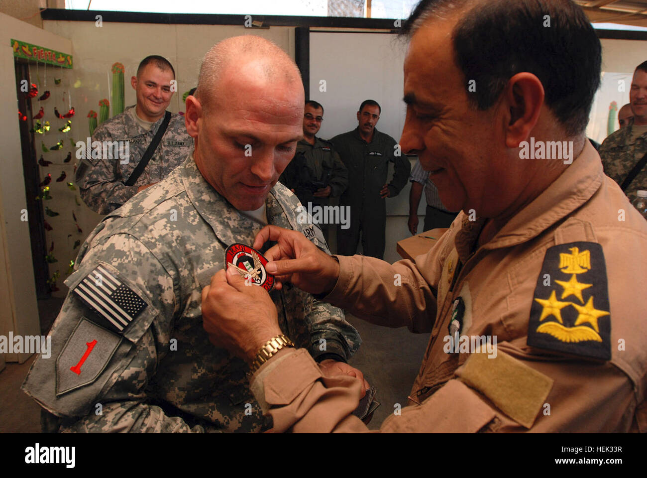 Iraqi air force Brig. Gen. Nadhem Lefta places his unit insignia patch ...