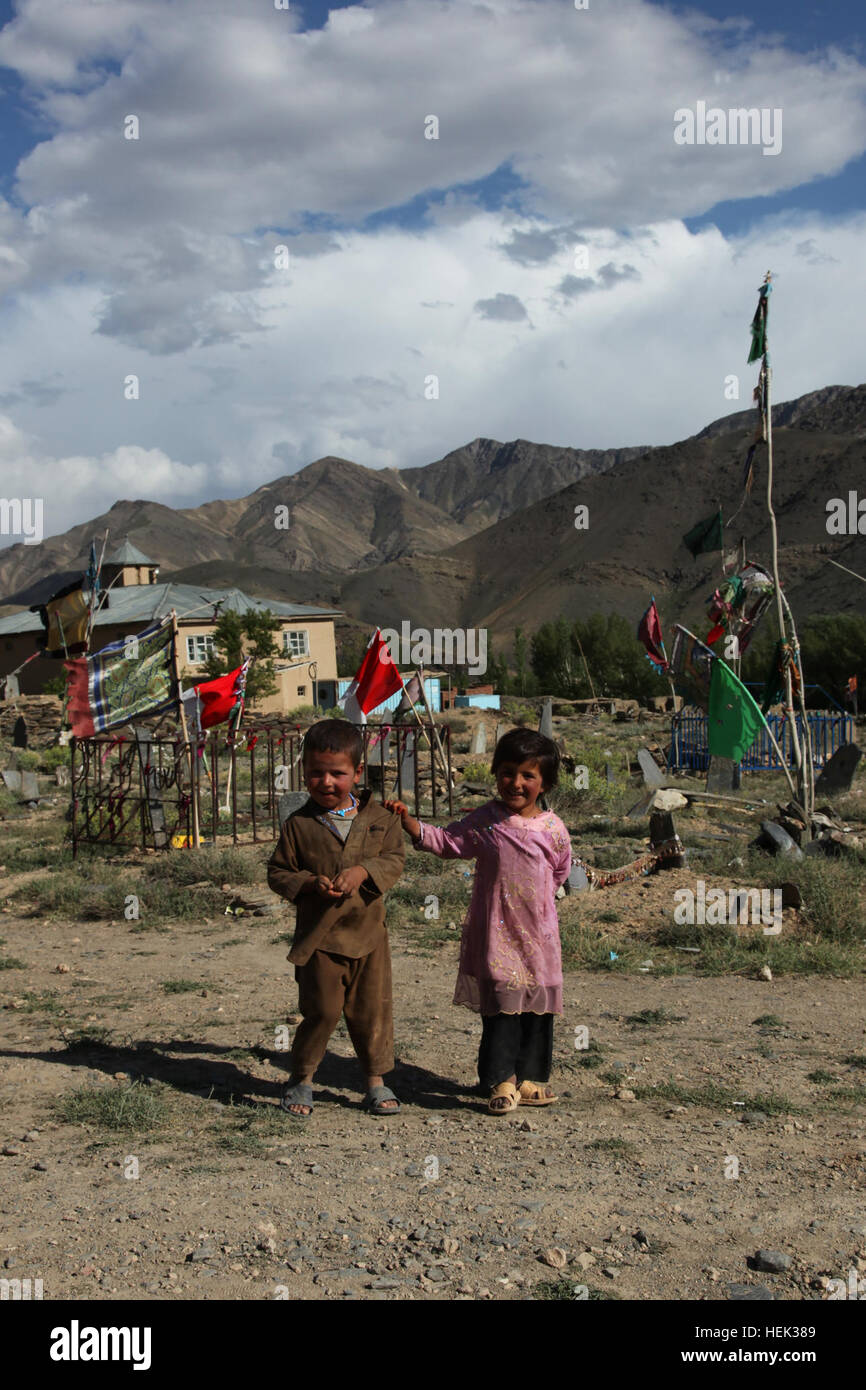 Afghan children look in wonder as they are being photographed near the ...