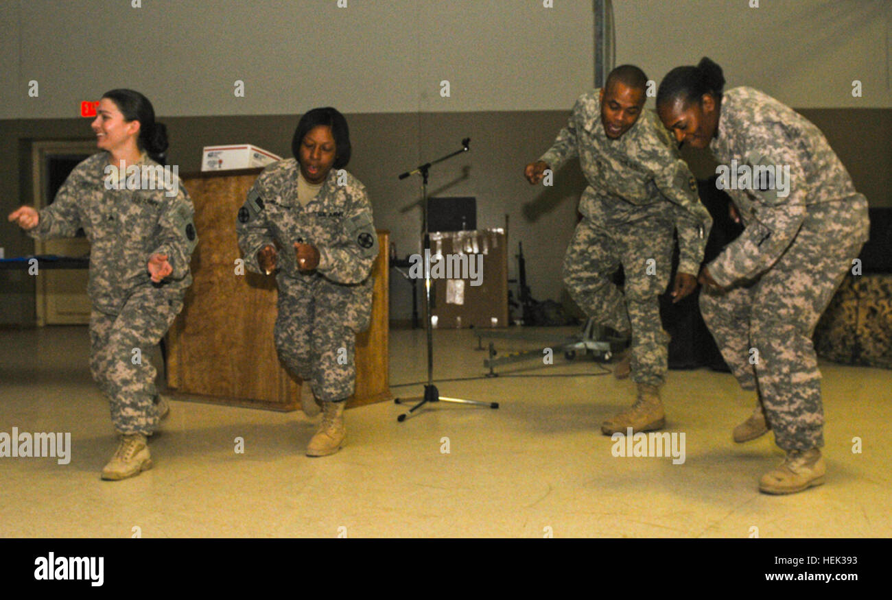 Soldiers with the 13th Sustainment Command (Expeditionary) dance their ...