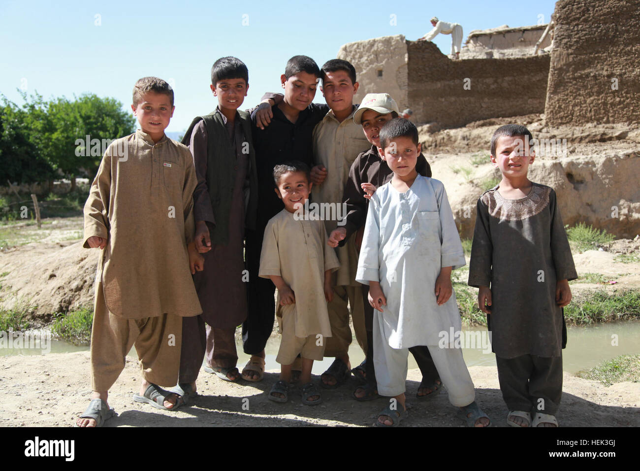 Afghan boys gather for a picture in the village of Qul'Eh-Ye Golay ...