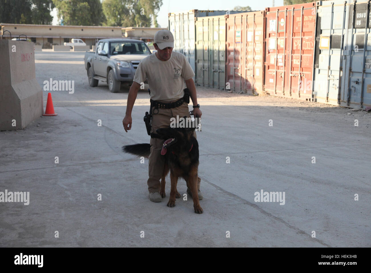 Amir Hassan walks with his with K-9 dog at Forward Operating Base ...