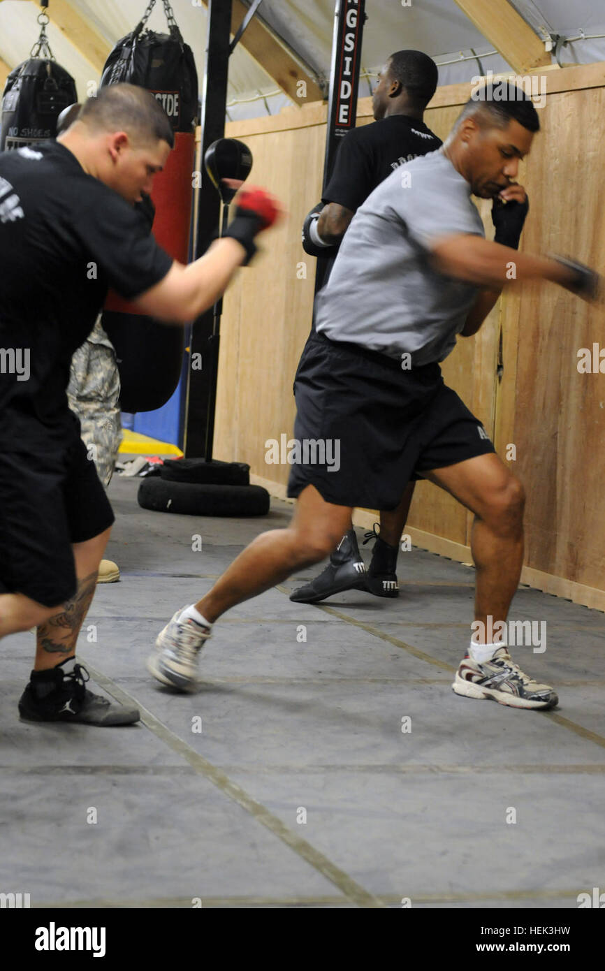 Spc. Amador Amador (left), a supply specialist, and Capt. James Battle ...