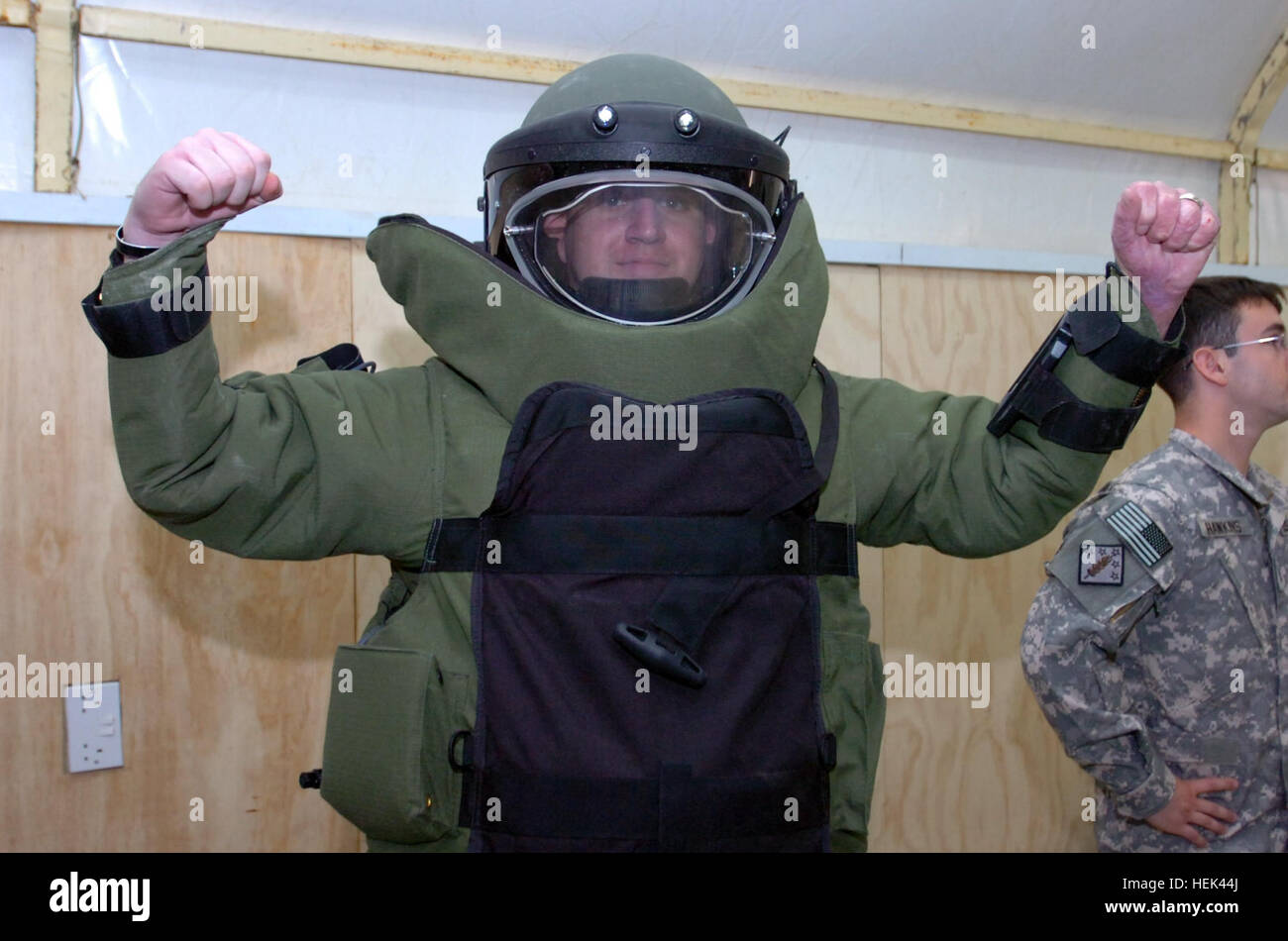 Sgt. Justin Pullen, from La Porte, Texas, tries on an explosive ...