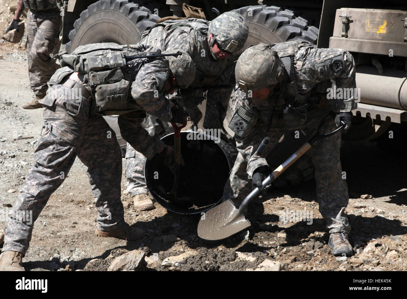 U.S. Army combat engineers fill in the previous improvised explosive ...