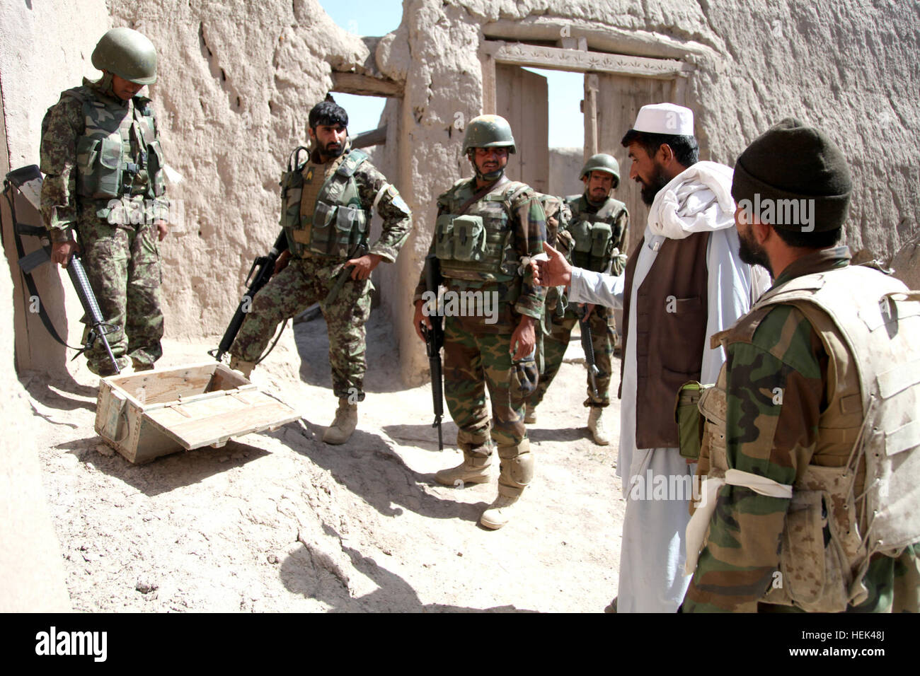 Afghan National Army Soldiers question a local national during ...