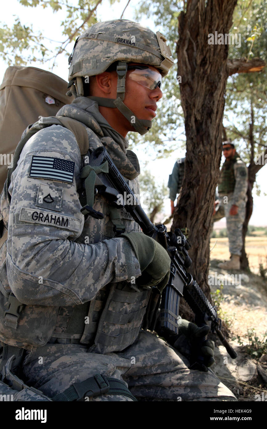 U.S. Army Pfc. Jacob Graham from Beardstown, Ill., conducts security as ...