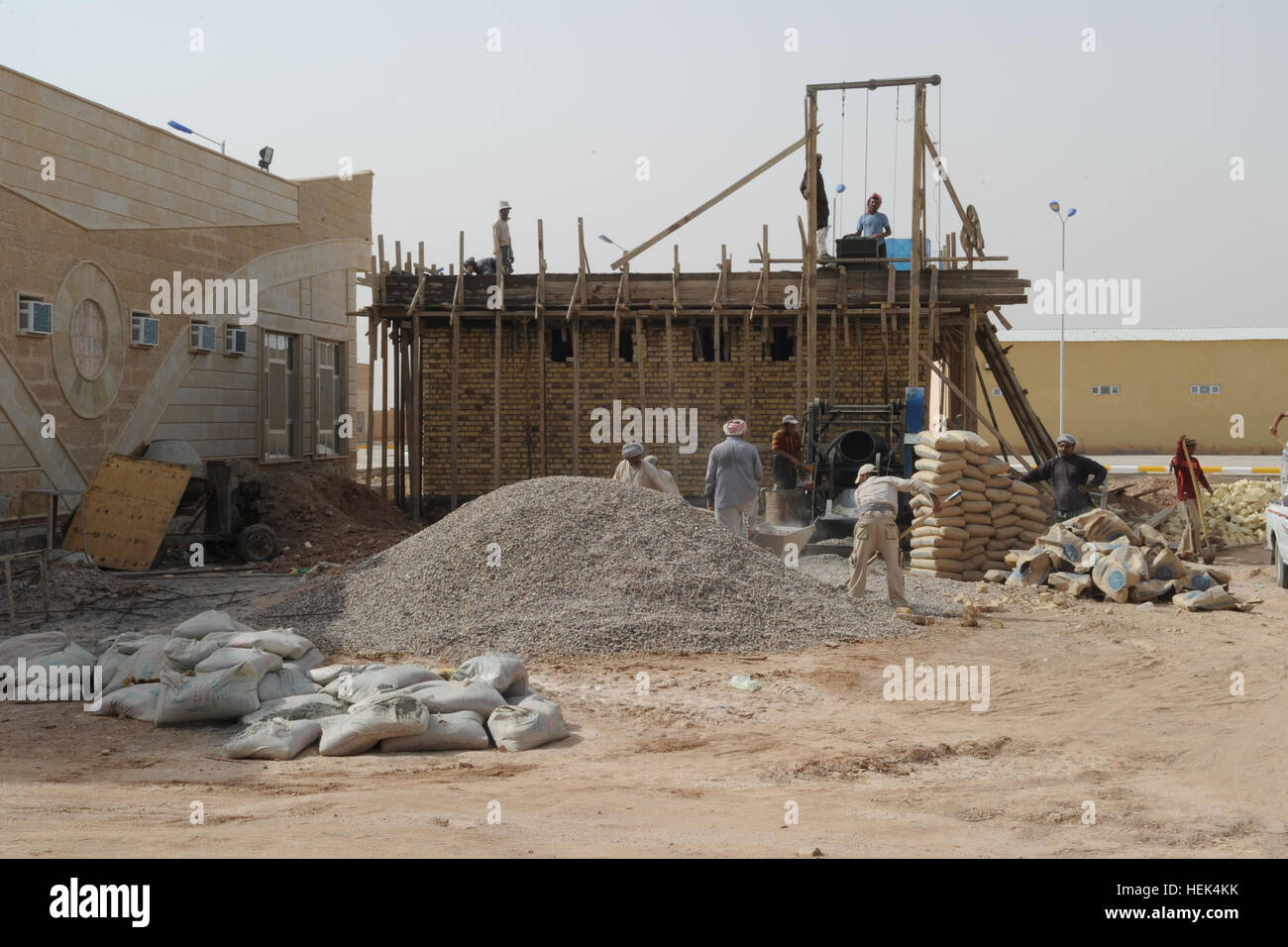 Iraqi workers develop facilities at the Iraq pedestrian traffic border ...