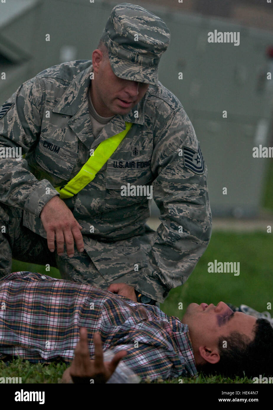 Tech Sgt. Matthew Crum reassures a victim until medics arrive after a ...