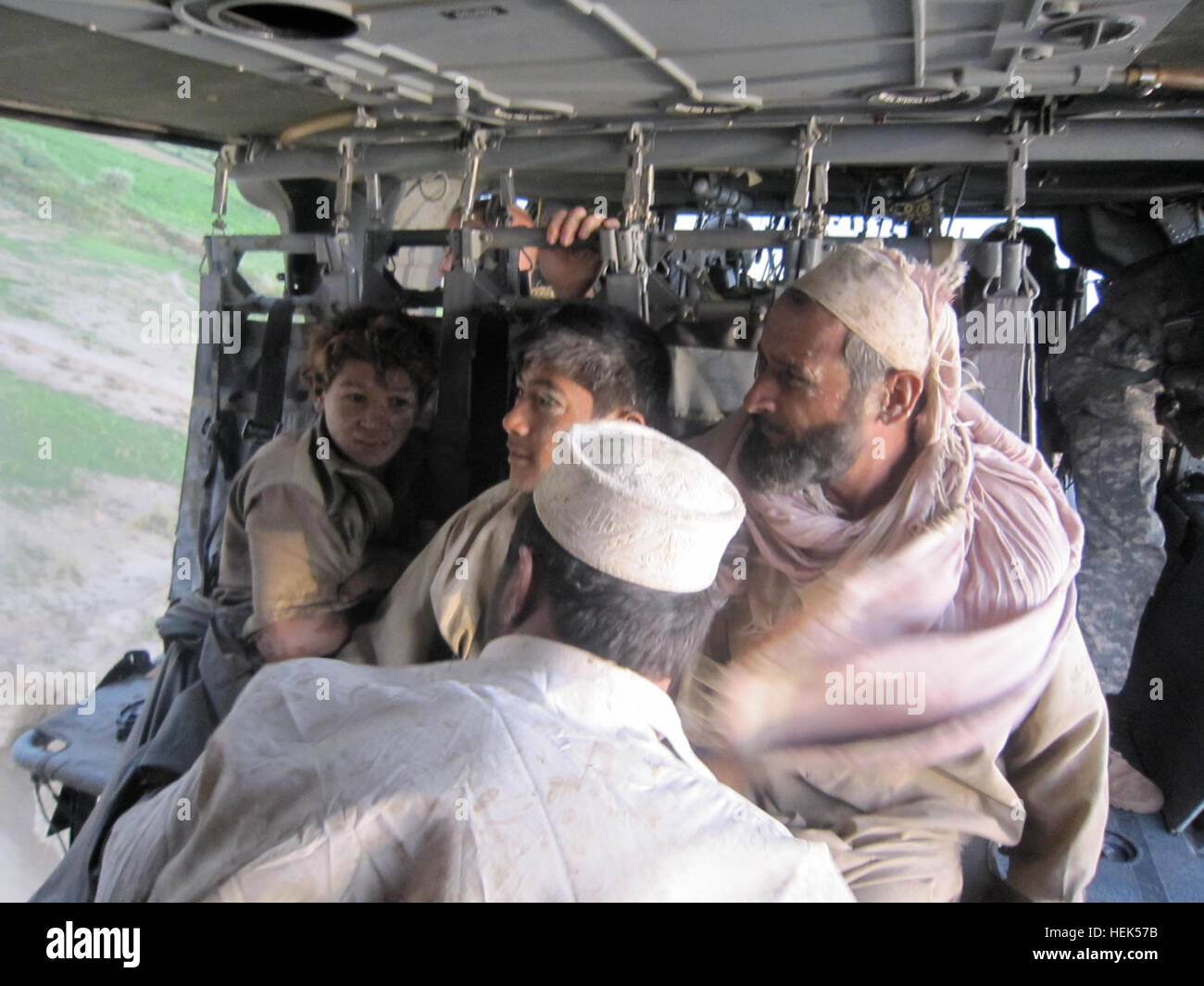 Afghans from Khost Province sit in a UH-60 Black Hawk helicopter after ...