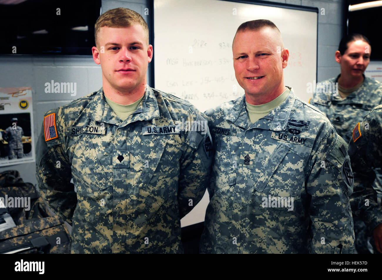 U.S. Army Spc. Carson Shelton, left, poses for a photo with Command Sgt ...
