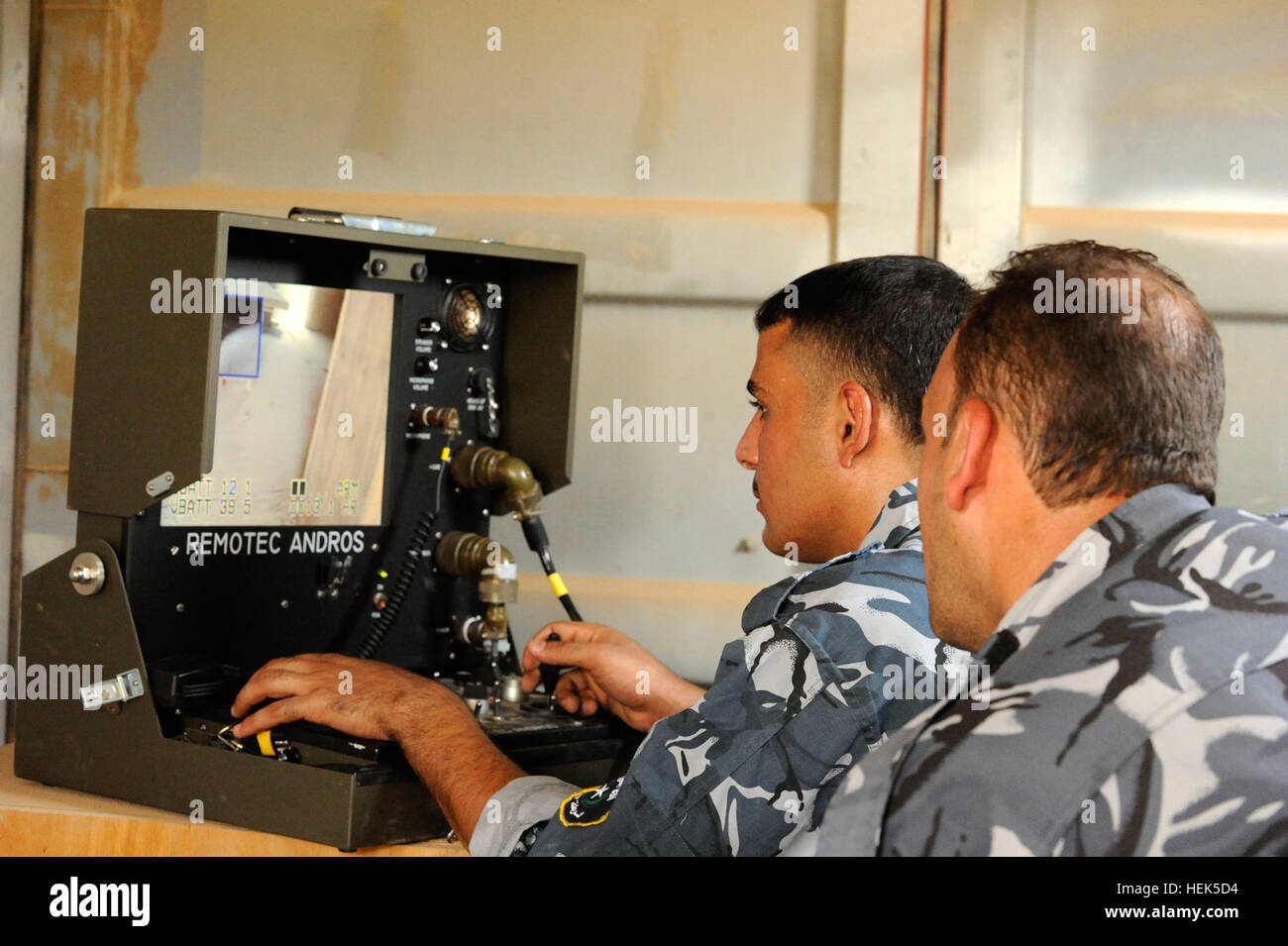 Iraqi Army soldiers with 5th Iraqi Army Bomb Disposal Company direct an ...