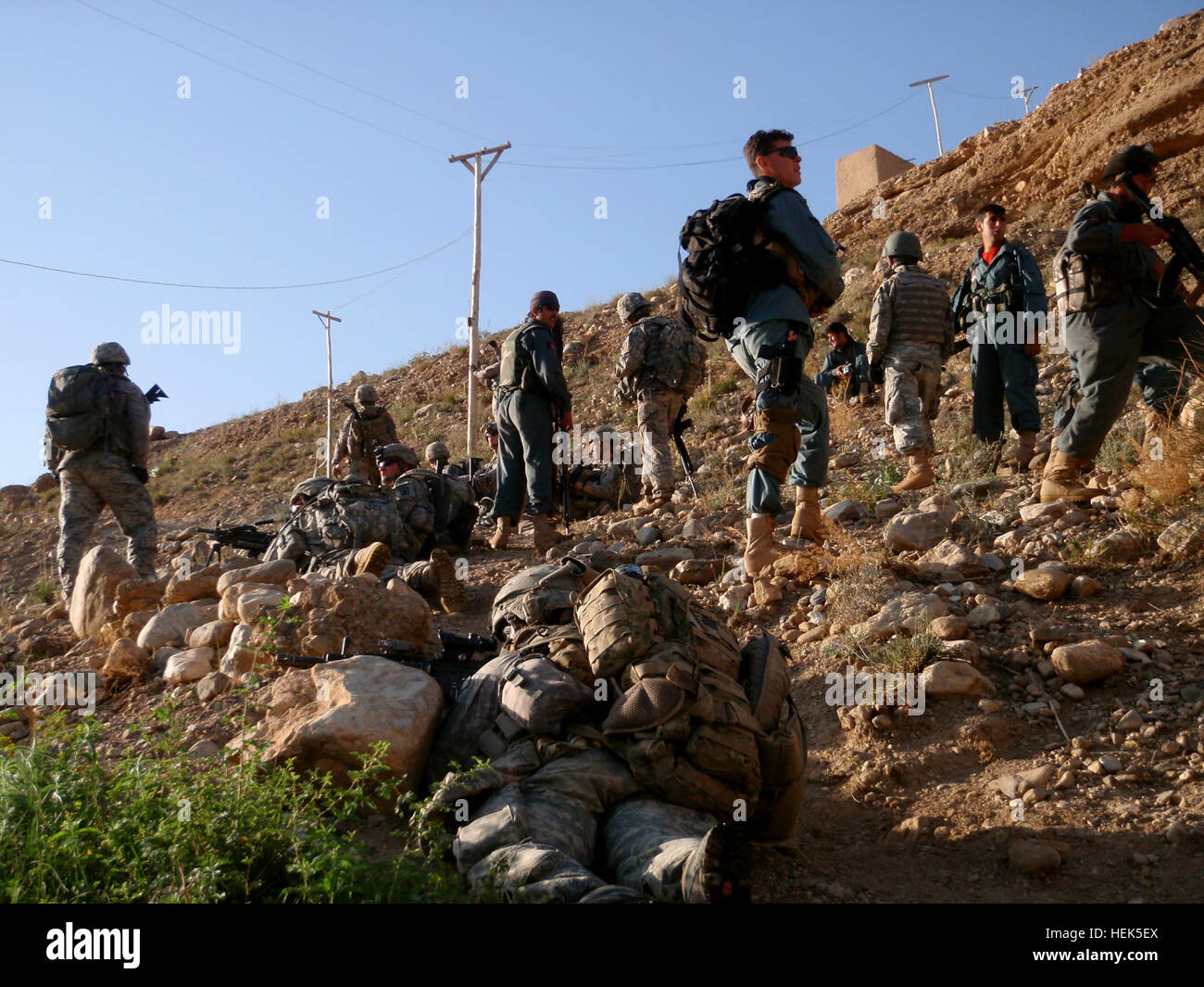 U.S. Army paratroopers provide security on a mountainside while Afghan ...