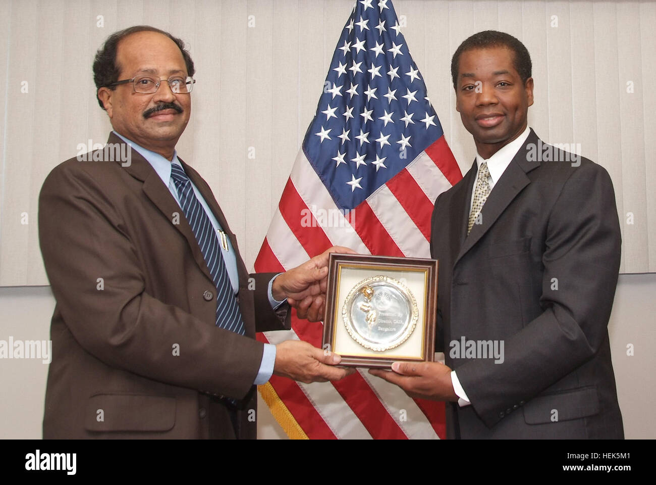 Dr. V.S. Mahalingam presents a gift to Matthew Warren on the first day ...