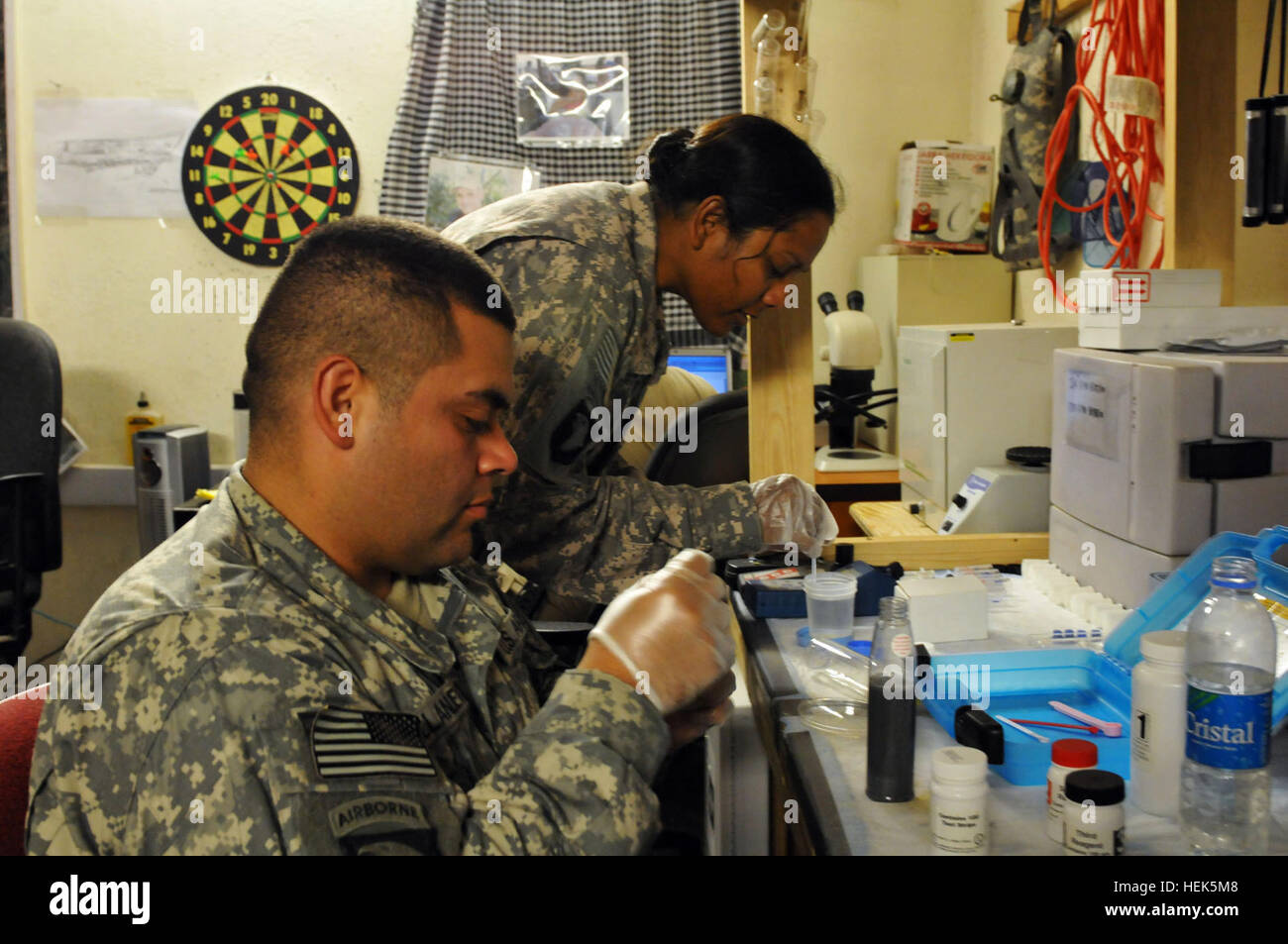 U.S. Army preventive medicine personnel test water samples for chemical ...