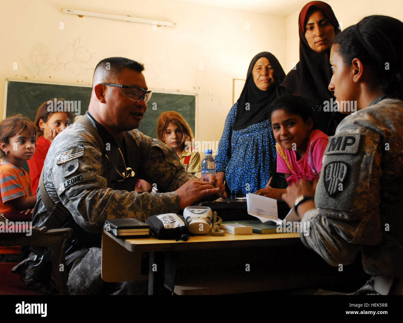 Lt. Col. Jonathan Leong (left), surgeon assigned to the 3rd Battalion ...