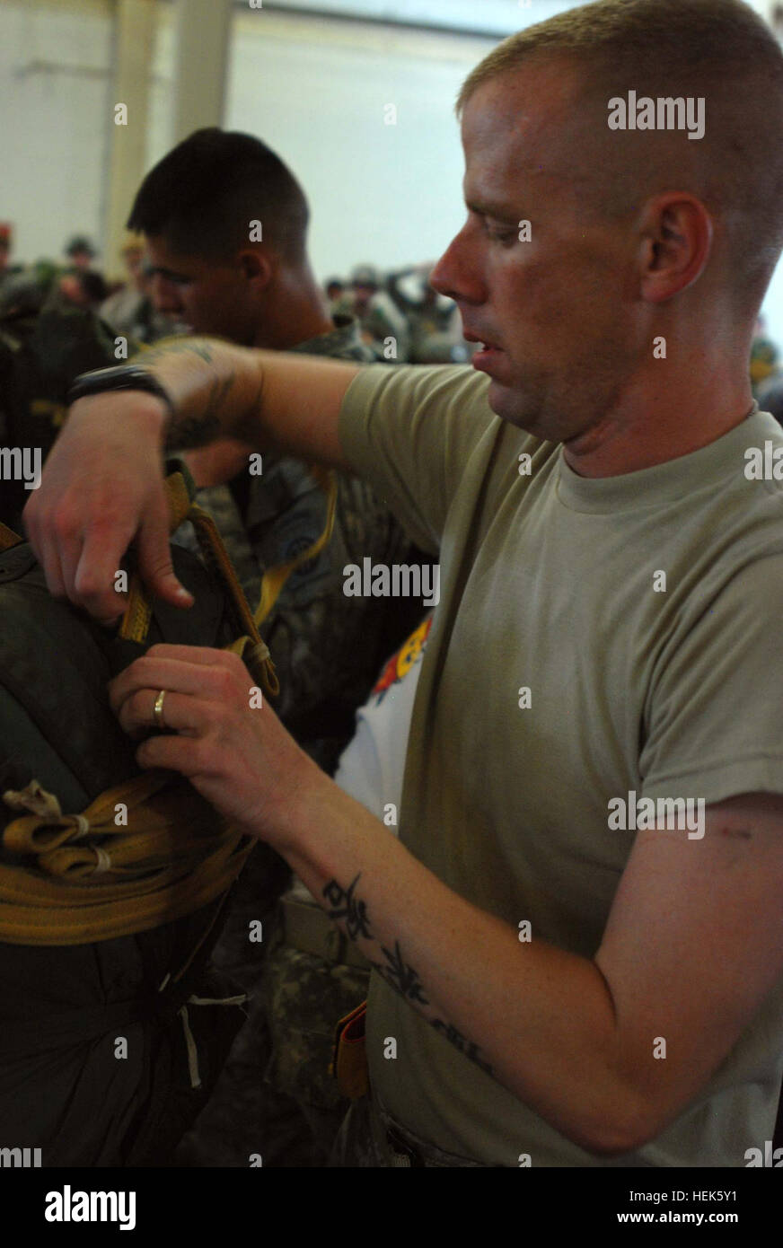 A 2nd Brigade Combat Team Jumpmaster insects a Paratrooper's static ...