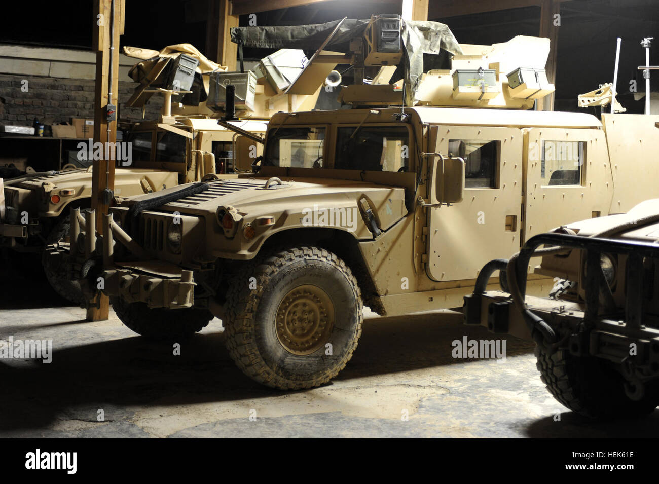 U.S. Army high mobility multi-purpose wheeled vehicles are staged the ...