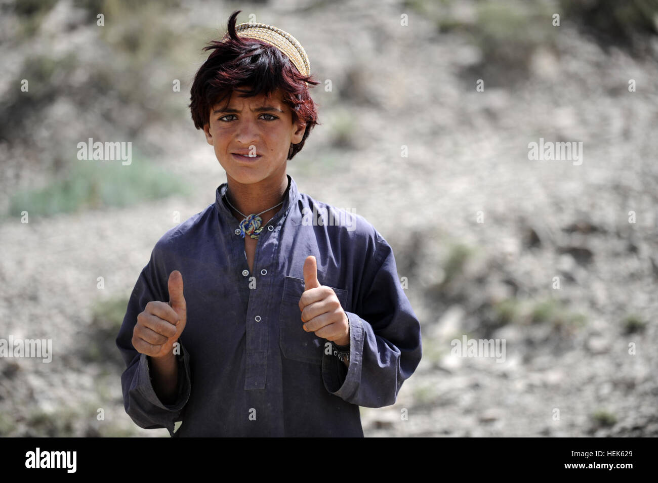 An Afghan boy gives thumbs up signs, as U.S. Army Special Forces and ...