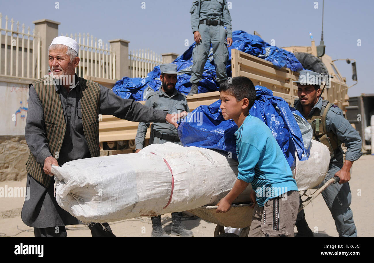 Afghan National Police from police district six assist a family with ...