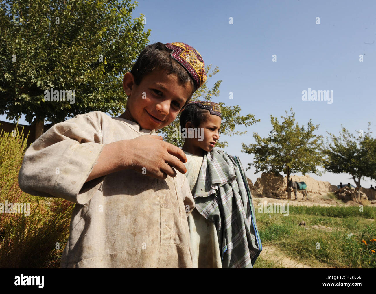 A pair of Afghan boys look on as a joint patrol of Afghan Special ...