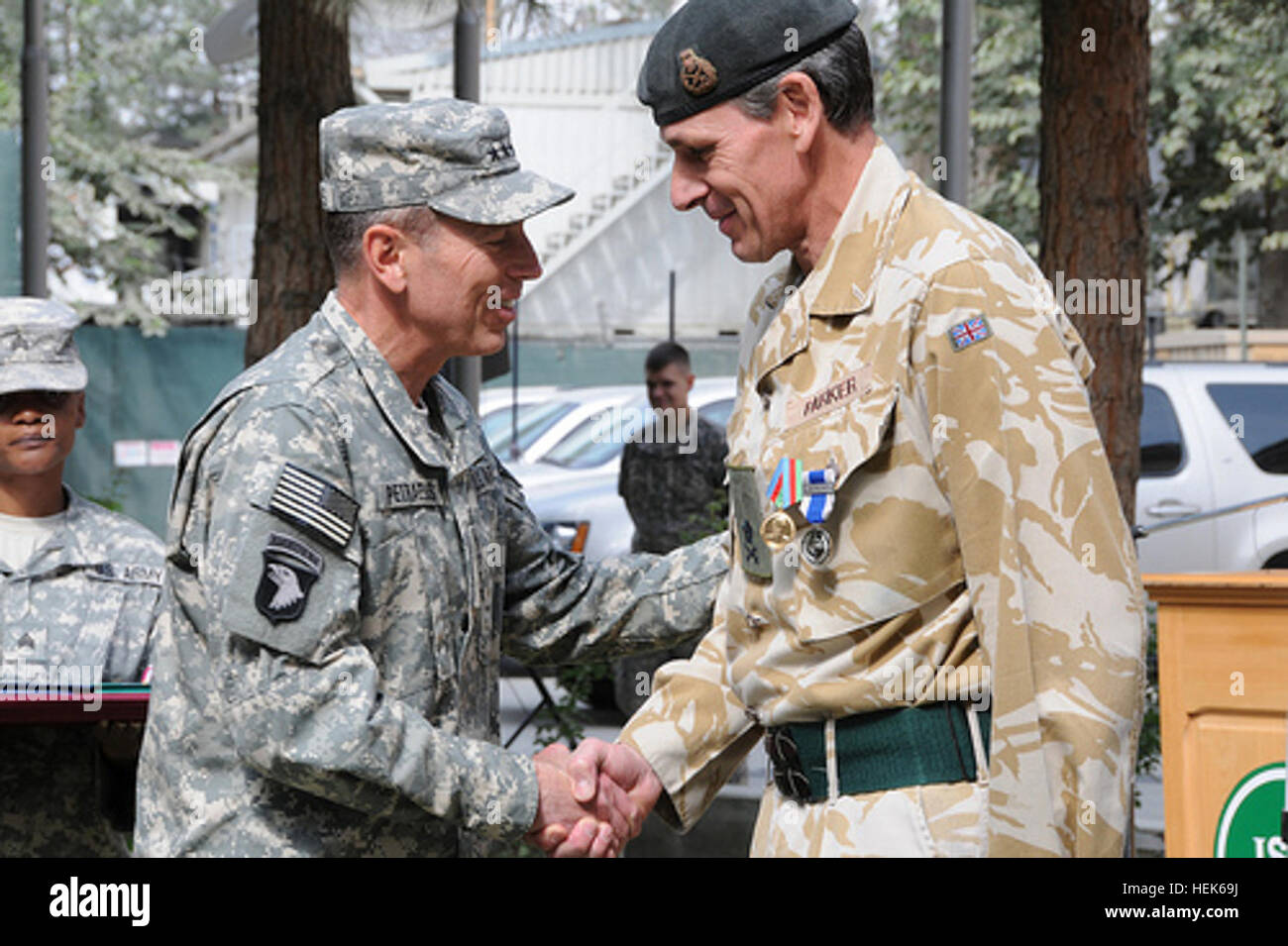 Gen. David H. Petraeus congratulates British Lt. Gen. Sir Nick Parker ...