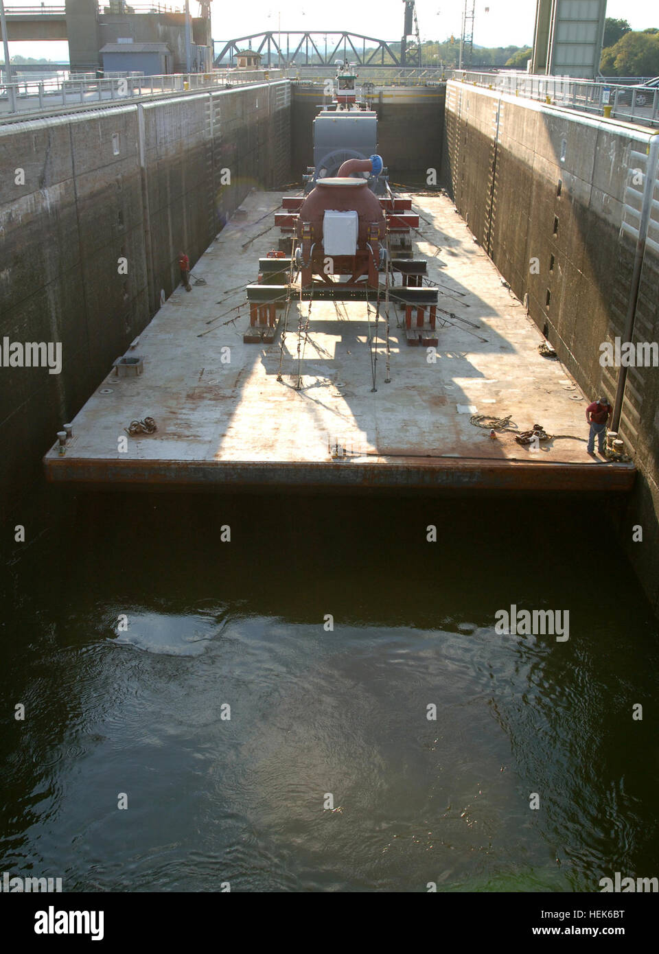 A barge carrying a 750,000-pound generator and 500,000-pound turbine ...