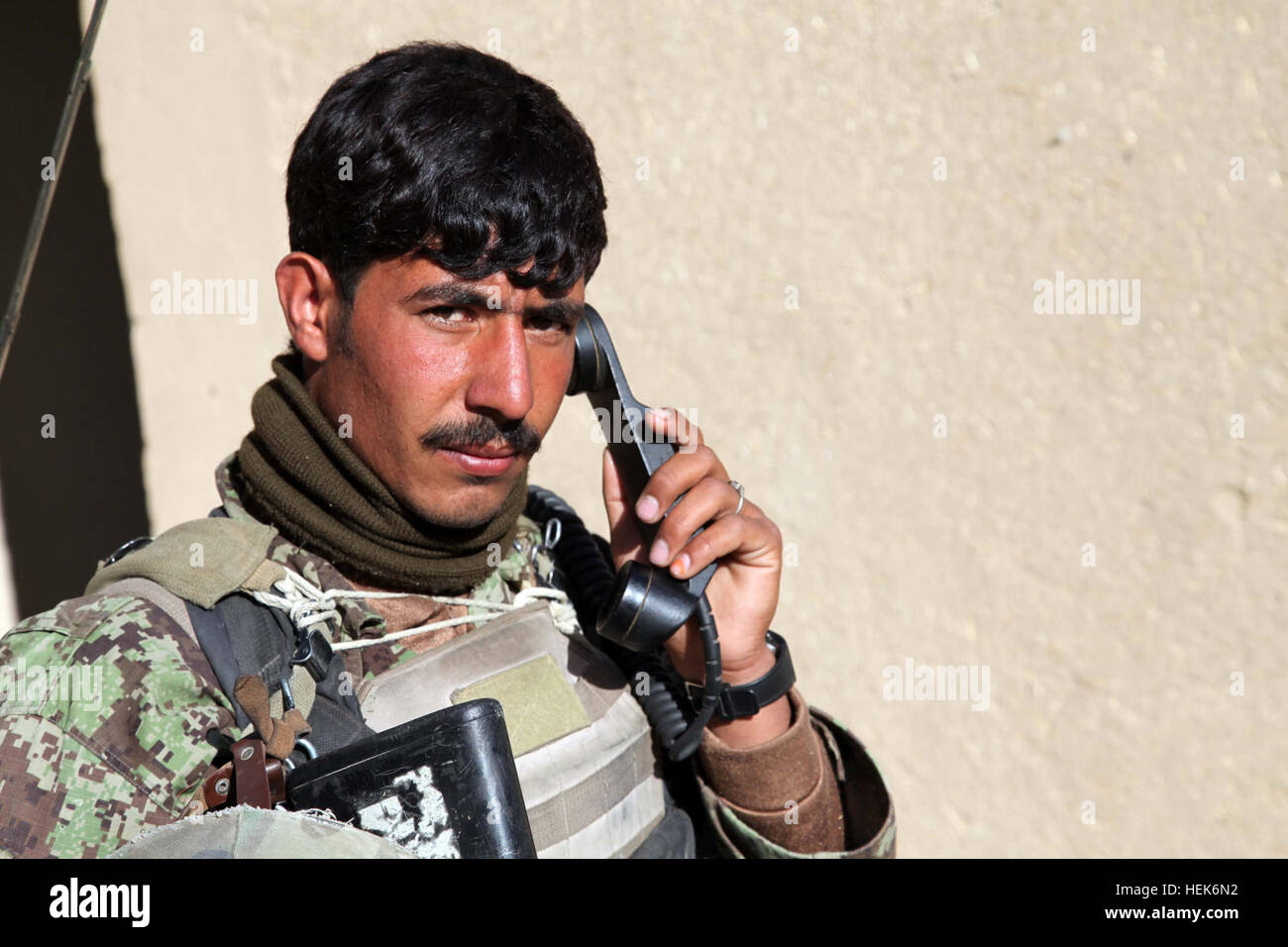 An Afghan National Army soldier communicates with superiors during ...