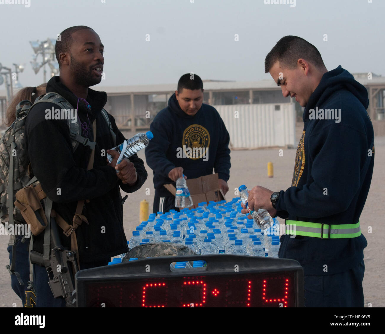 Sailors man a water point at the finishing line of the Army Ten-Miler ...