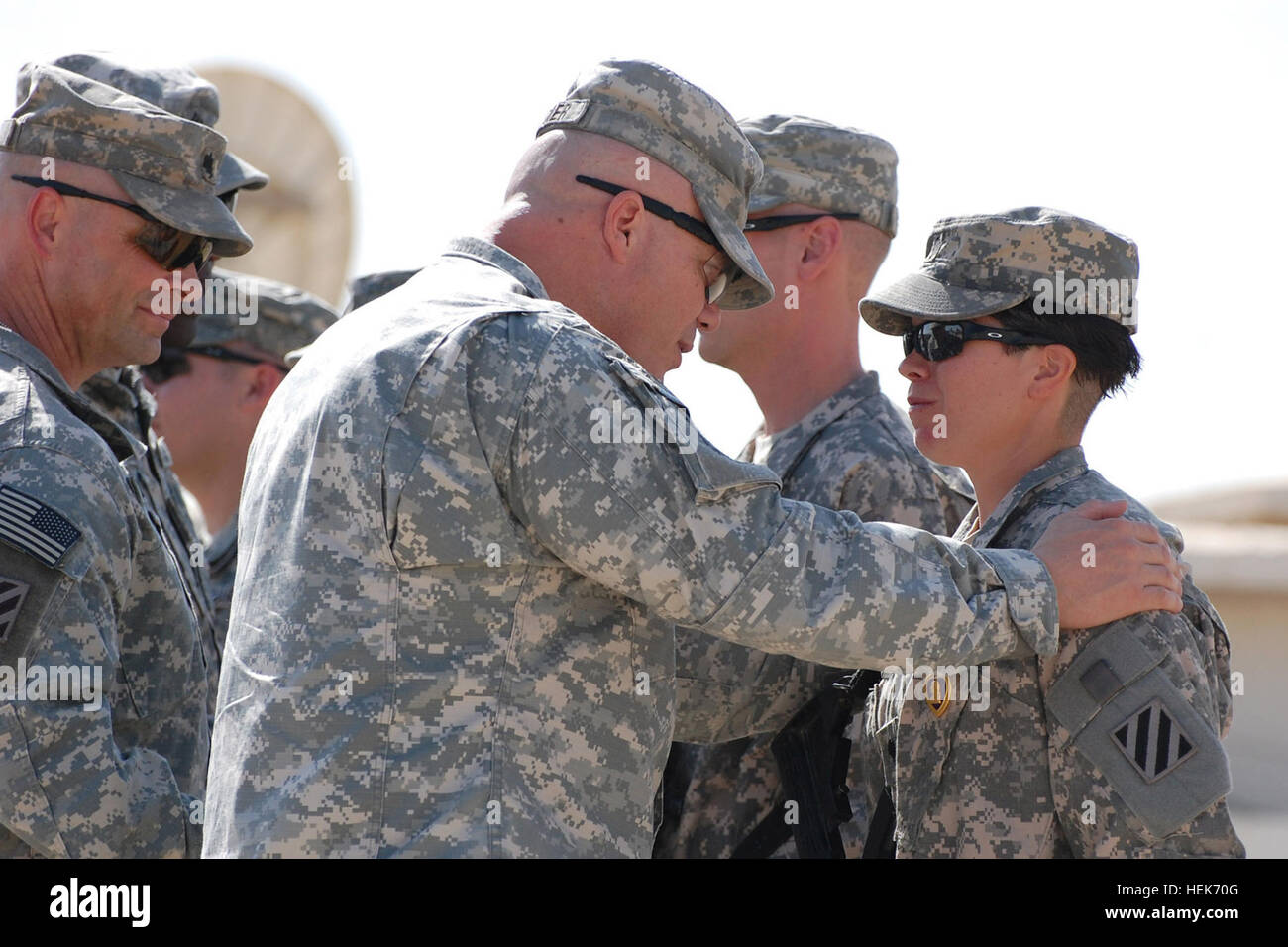 Col. Roger Cloutier (center), commander of 1st Advise and Assist ...