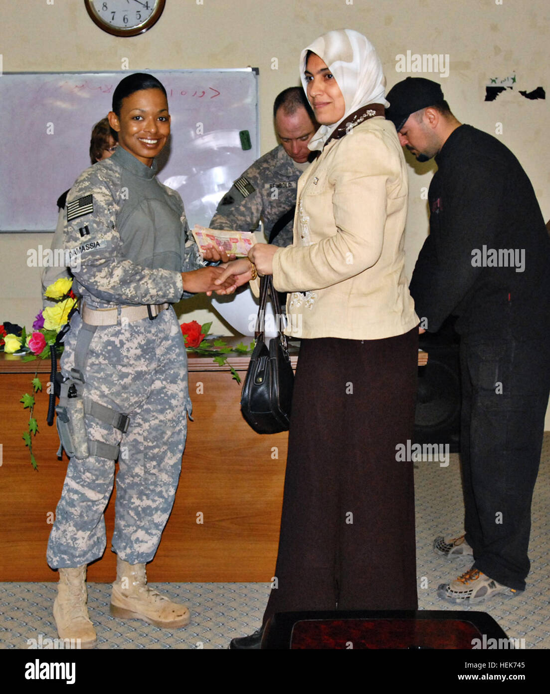 Military liaison officers deliver micro-grants and medical supplies ...