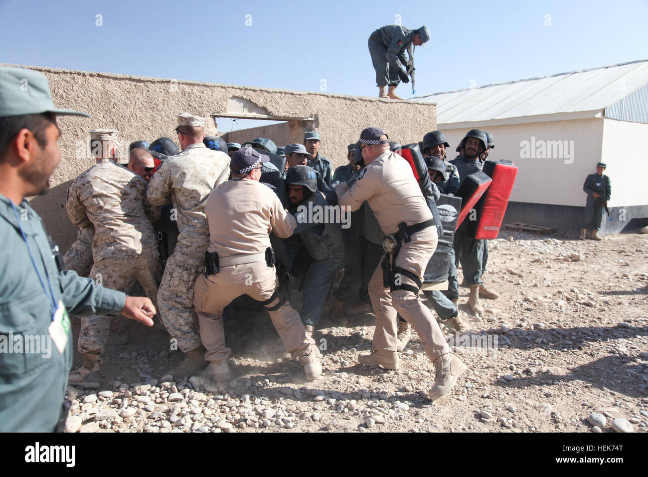Afghan National Police students conduct riot control operations as ...