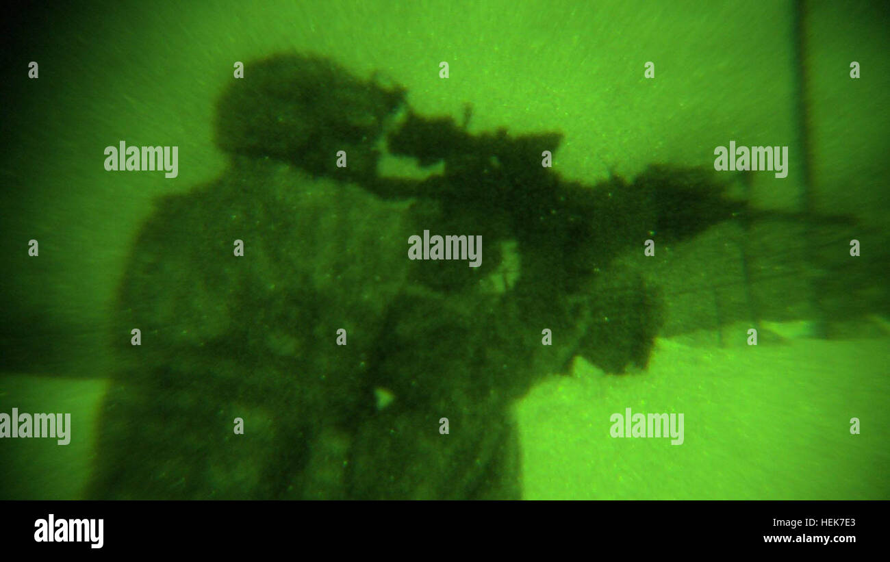 An Indian Army soldier prepares to clear a building during an air ...