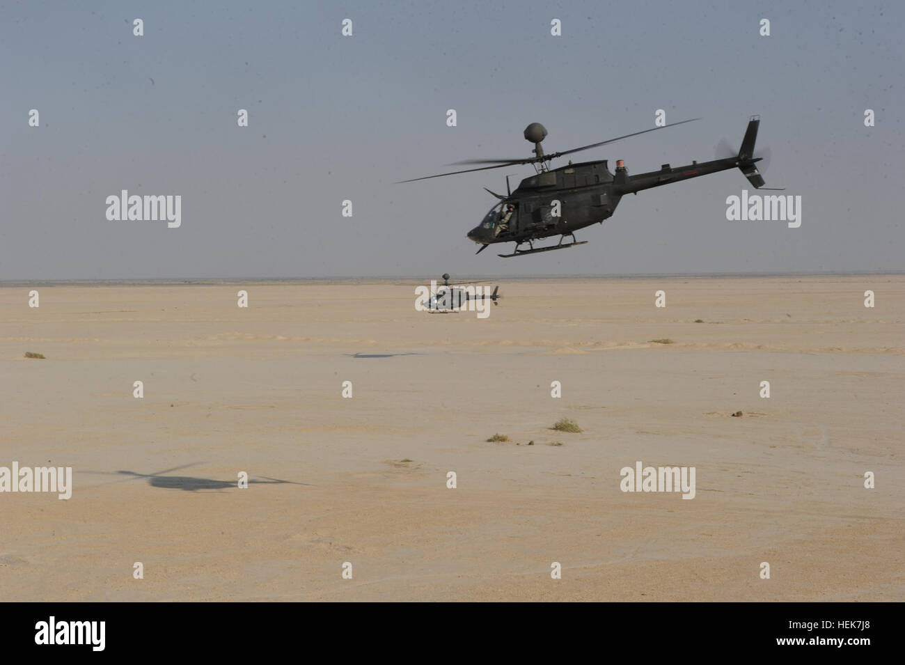 An OH-58D Kiowa Warrior across the desert of the Besmaya Range, Forward ...