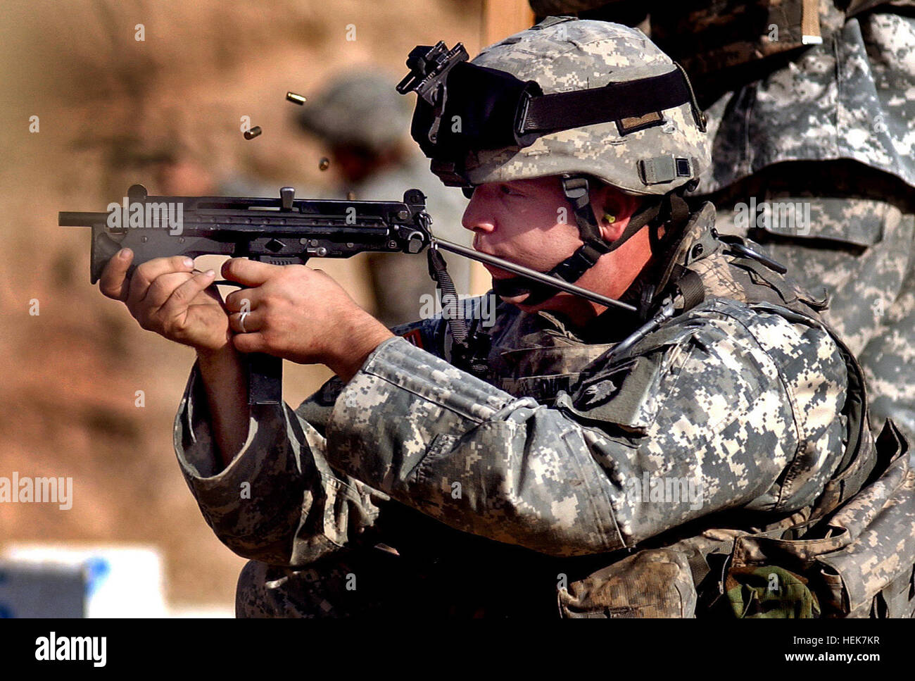 U.S. Army Sgt. Daniel Dunlap familiarizes himself with the operation of ...