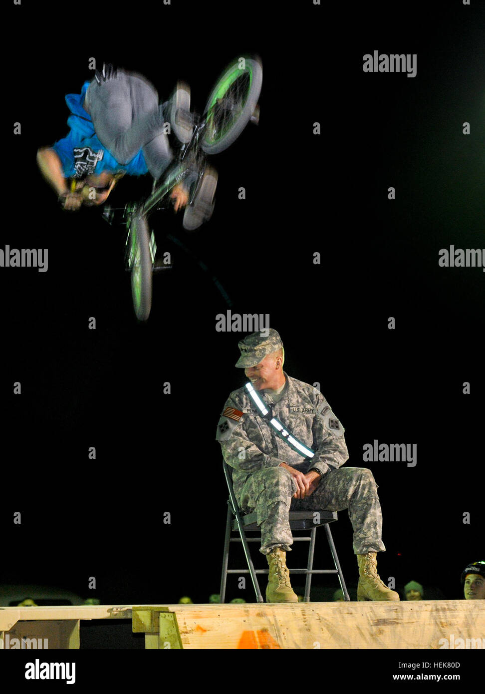 BMX rider Drew Bezanson vaults over Maj. Gen. David G. Perkins ...