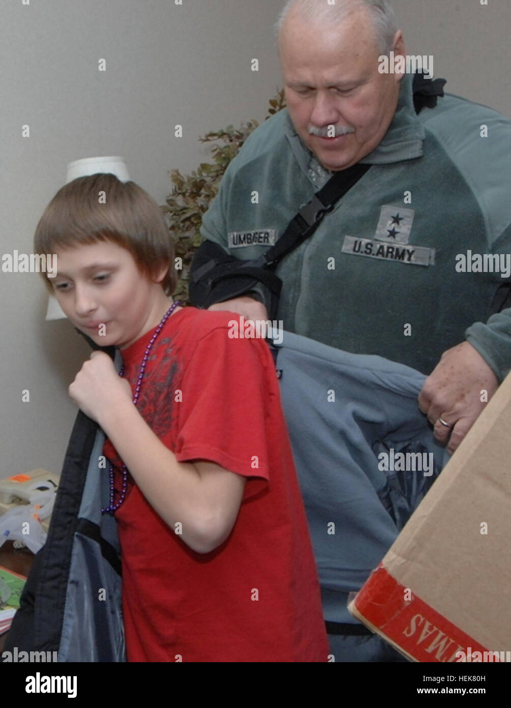 Indiana's adjutant general; Maj. Gen. R. Martin Umbarger places a coat ...