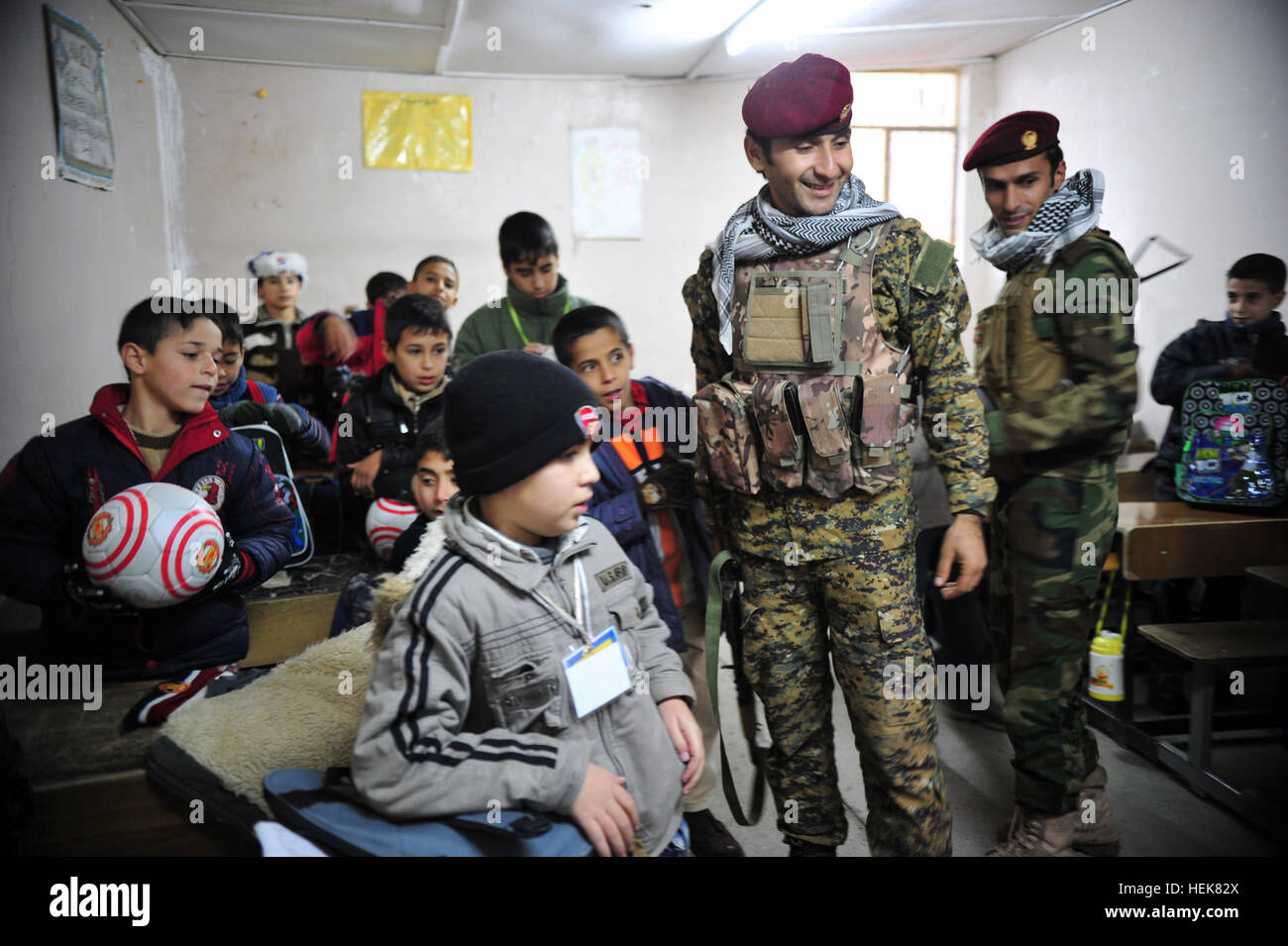 Iraqi school children interact with Iraqi Security Forces during a ...