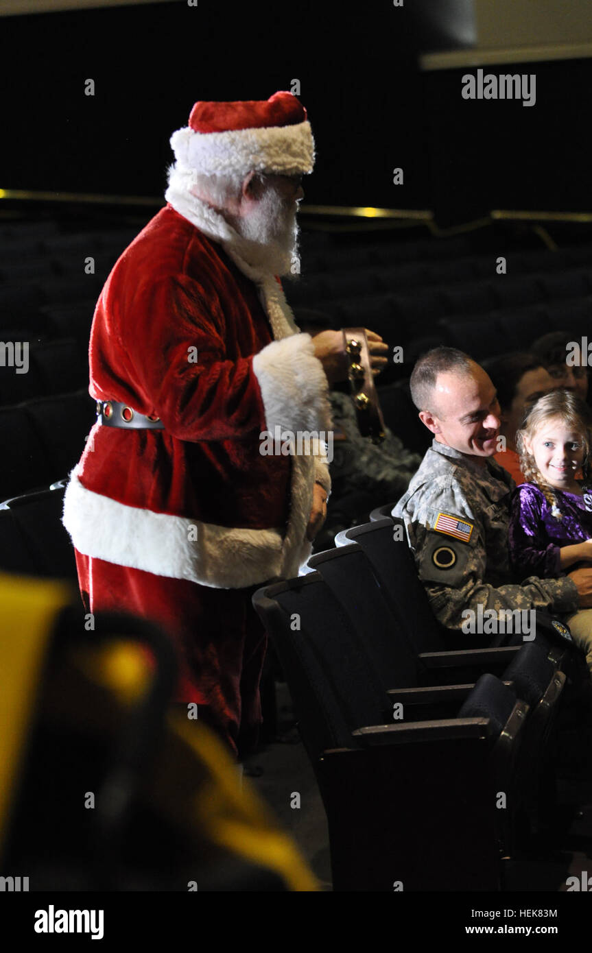 Four-year-old Mia Waller (far right), beams as Santa Claus visits with ...