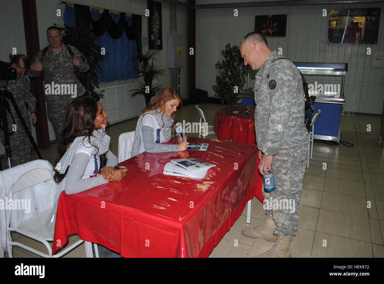 A servicemember meets Nicole Hamilton and Brandi Redmond of the Dallas ...