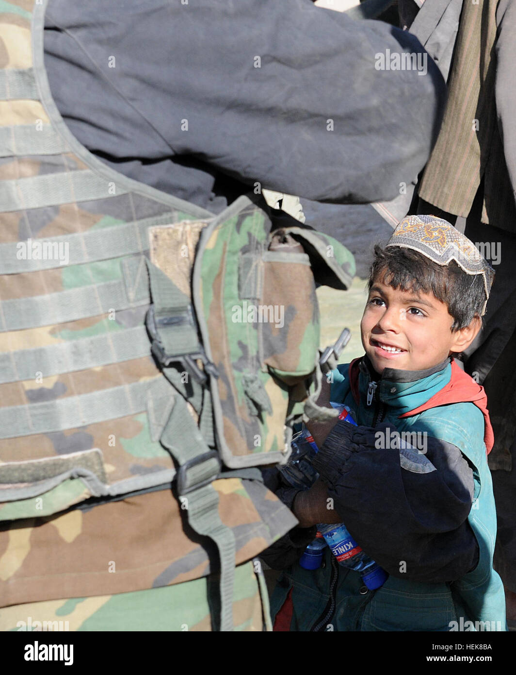 TANGI VALLEY, Afghanistan – An Afghan boy stares at an Afghan National ...