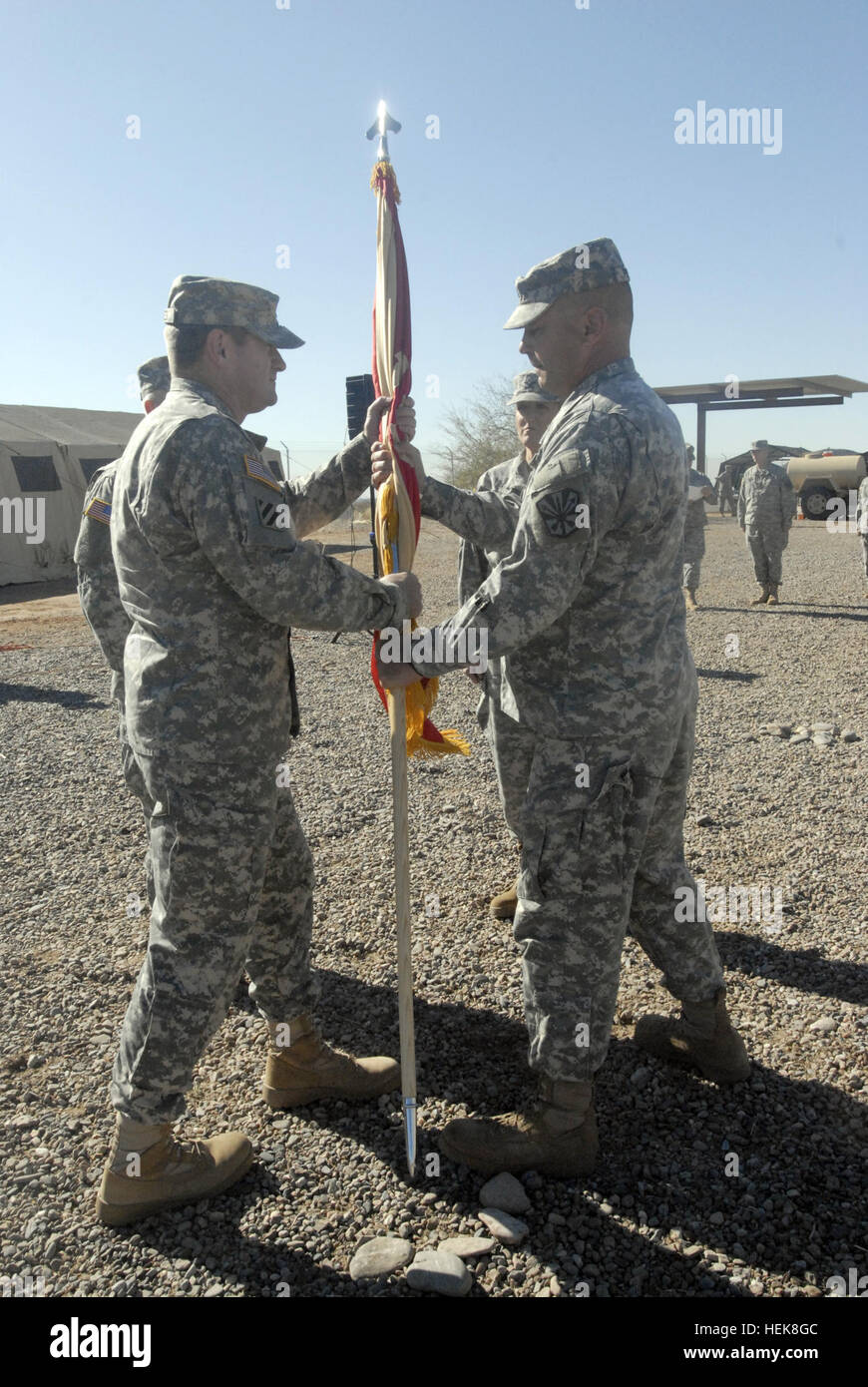 The 198th Regional Support Group Command Sgt. Maj. Patrick Powers hands ...