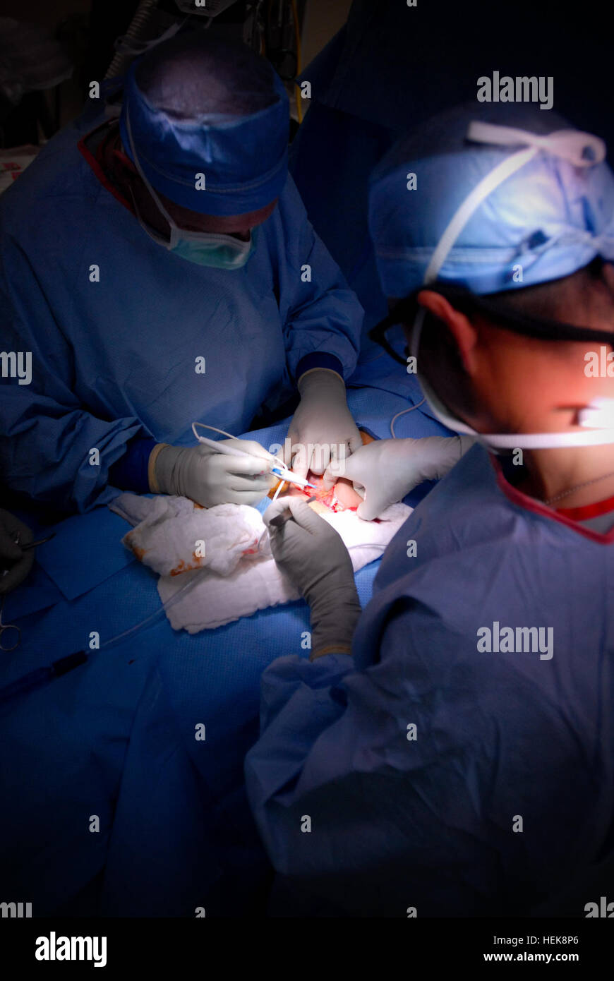Medical personnel at Kandahar Air Field Role III hospital conduct an ...