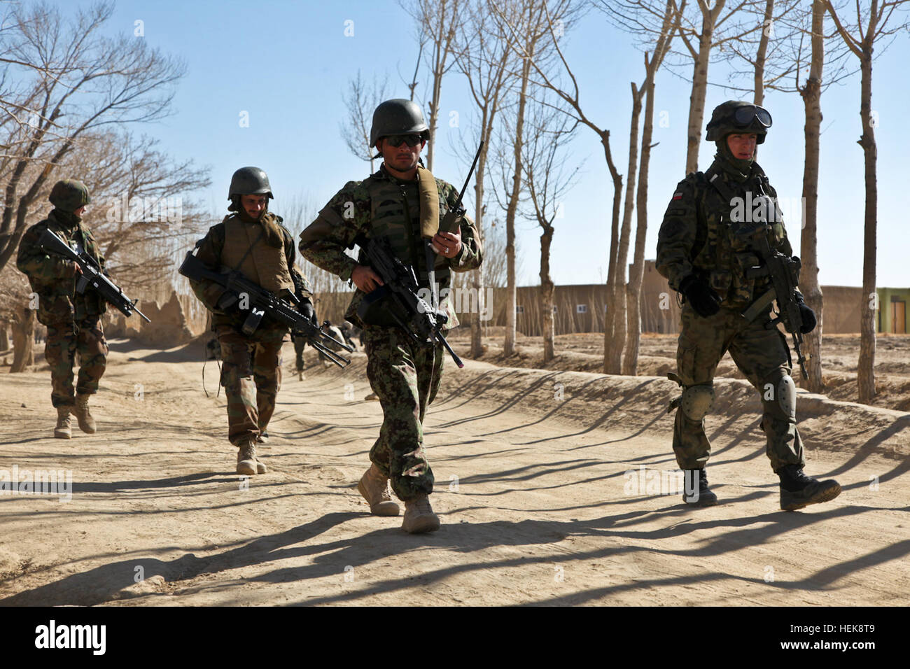 A group of Afghan National Army soldiers advance the formation during a ...